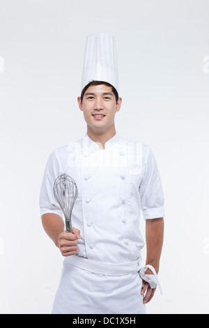 a male cook posing with cooking tool Stock Photo - Alamy