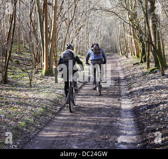 Girl with backpack and bicycle in rural landscape Stock Photo - Alamy
