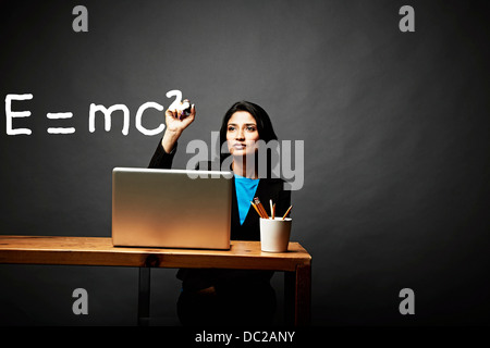 asian business woman solving a mathematical formula Stock Photo - Alamy