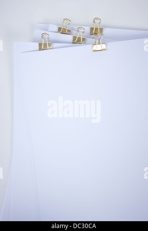 golden double clips Stock Photo - Alamy