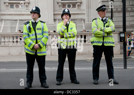 London metropolitan Police bored and watching and policing a protest ...