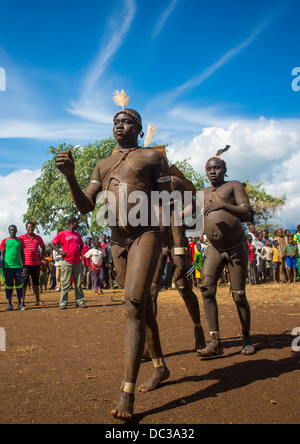 Bodi Tribe Fat Men Running During Kael Ceremony, Hana Mursi, Omo Valley ...