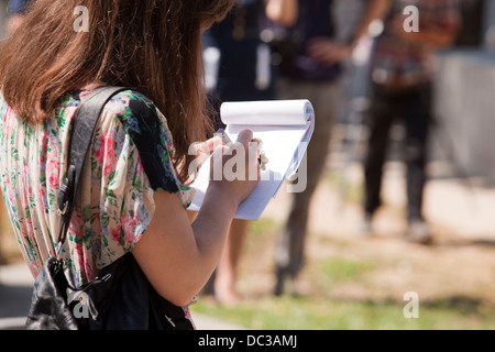 journalist is taking notes Stock Photo - Alamy