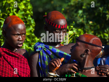 Three Mursi women of the Omo Valley in Ethiopia with lip plates, bone ...