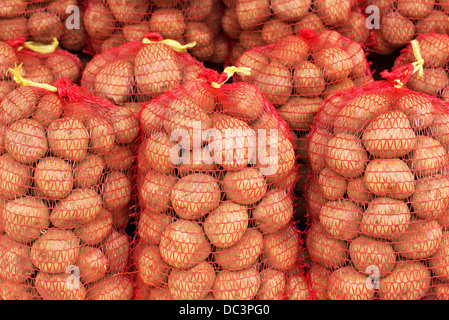 Red potato sacks on the street market Stock Photo - Alamy