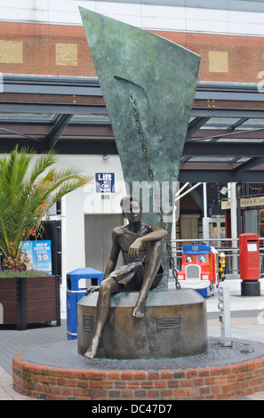 Statue of a boy and a prow of a ship, Gunwharf Quays, Portsmouth, UK ...