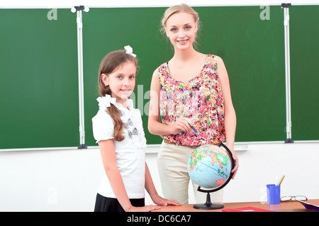 teacher explains the lesson in geography Stock Photo - Alamy