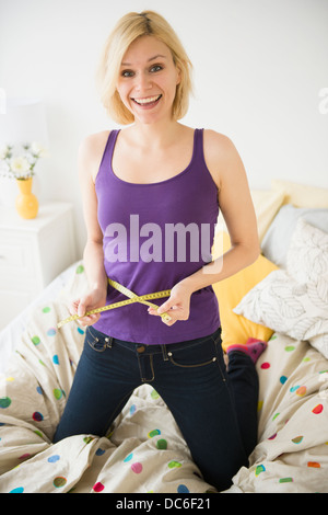 Young woman weight measurement Stock Photo - Alamy