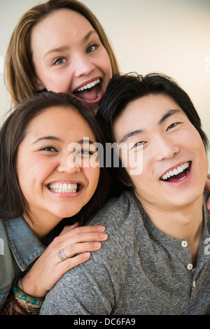 Portrait of a cheerful young man and woman in love, laughing and ...