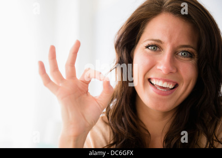 Hand of caucasian young woman gesturing approval expression doing okay ...