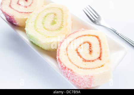 Set of colorful jam roll cakes with fork, stock photo Stock Photo - Alamy