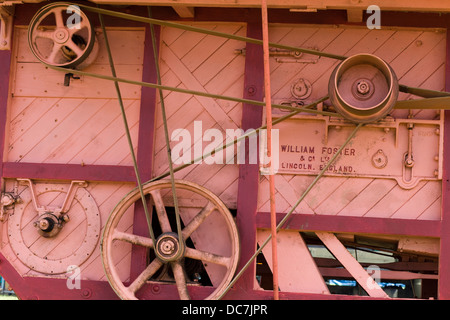 A William Foster & Co Ltd threshing machine powered by a steam traction ...