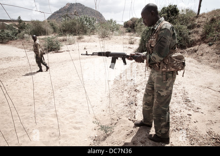 Park rangers from the Kenya Wildlife Service pose with their AK47s ...