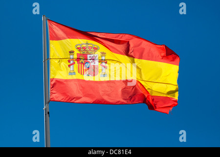spain flag on blue sky Stock Photo - Alamy