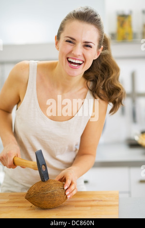 Coconut and a hammer Stock Photo - Alamy