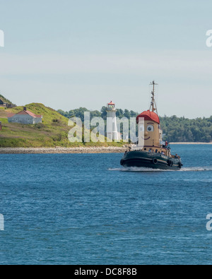 Tourist cartoon character Theodore tugboat and sailboat in Halifax ...