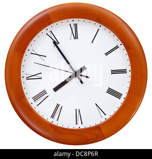 five minutes to eight o clock on the dial round wall clock Stock Photo ...