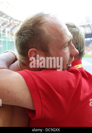 Germany's Robert Harting celebrates winning the gold medal in the men's ...