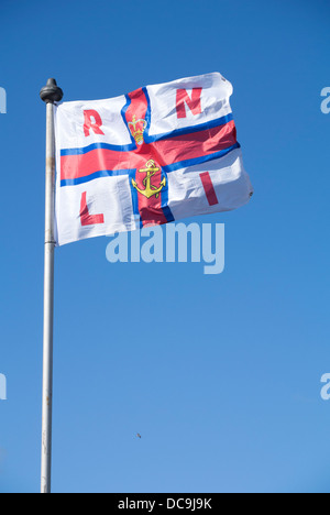 A RNLI flag blowing in the wind . Credit: Ian Jones/Alamy Live News ...