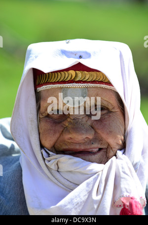 An old Dinaric highlander wearing traditional head wear and ornaments ...