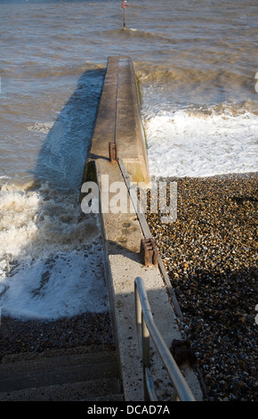 Concrete beach groyne shingle sediment levels different heights ...