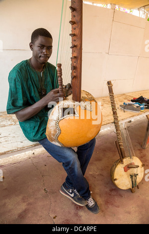 Young Man Playing the Kora, a Stringed Instrument of the Western Sahel ...