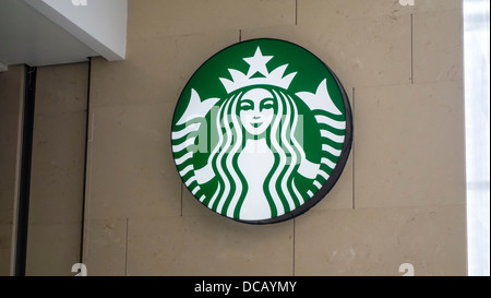 Starbucks Coffee round cafe logo signboard at night, bright logo sign ...