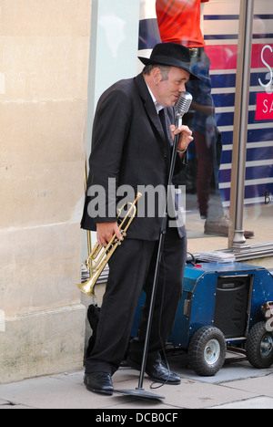 Busker in Bath Somerset singing Stock Photo - Alamy