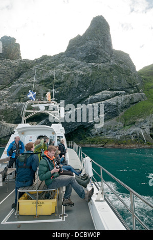 Tourist boat approaching the island of Boreray, St Kilda archipelago ...