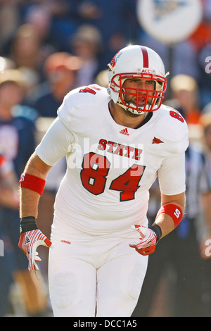 North Carolina State tight end Justin Joly (7) runs as Miami defensive lineman Armondo Blount ...
