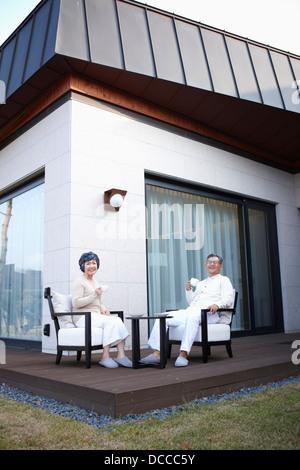 middle aged couple having cup off coffee Stock Photo - Alamy