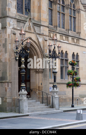 Office building entrance with ornate carved door Stock Photo - Alamy