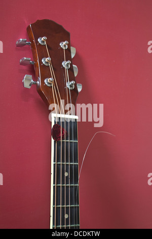 A guitar with a broken string Stock Photo - Alamy