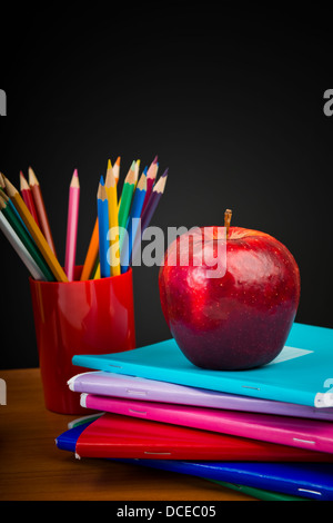 School notebook and pencil on red background, back to school concept ...