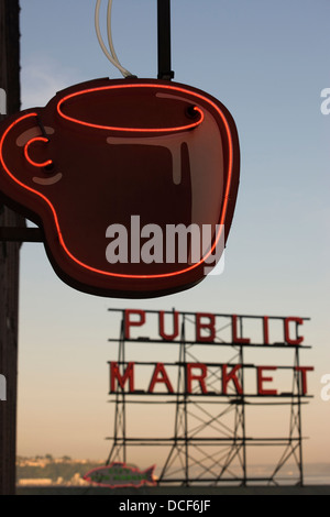 Cup of coffee neon sign with Pike Market neon sign in the background at ...