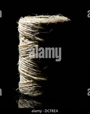 coin of yarn in dark back Stock Photo - Alamy