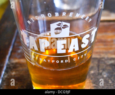 A pint of pale ale in a printed glass at Tap East bar, Westfield ...