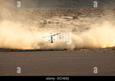 A Bell AH-1 Cobra attack helicopter with its XM197 20mm cannon under ...