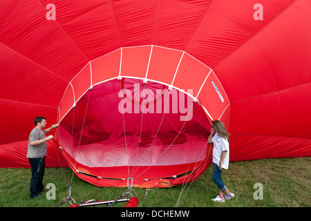 Inflating balloons at the Bristol Balloon Festival where the weather ...