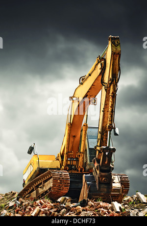 Large digging excavator machine works to move dirt in wooded area Stock ...