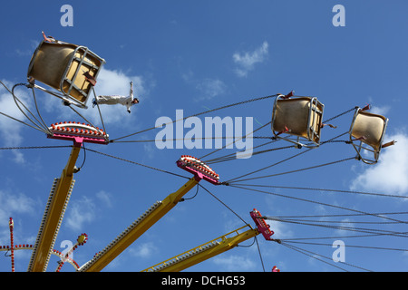 Human cannonball David Smith, Jr., shooting over a carnival ride at the ...