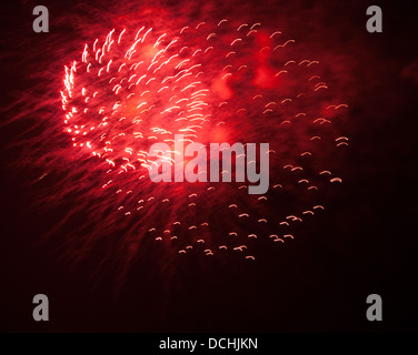 Bright, beautiful red fireworks in the night sky. High quality photo ...