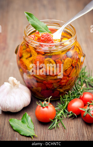 Sun-dried tomato in olive oil with herbs and spices Stock Photo - Alamy