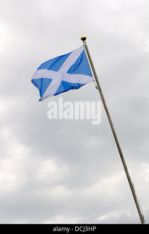 Scottish flag Saltire on flag pole against broken could sky Stock Photo ...