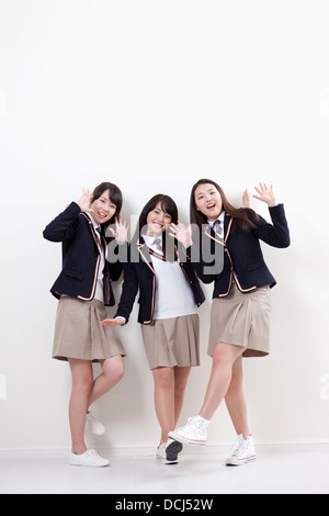 students in uniform posing happily Stock Photo - Alamy