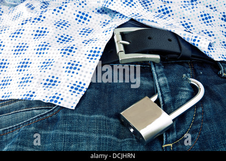 Steel Padlock locked submitting jeans under Men's shirt Stock Photo - Alamy