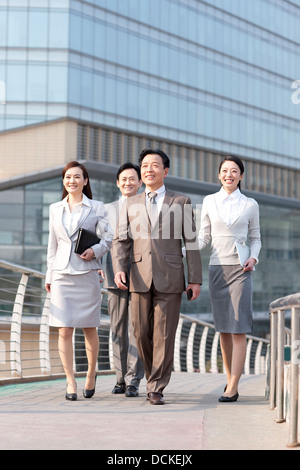 Business team walking forward - leadership and teamwork concepts using ...