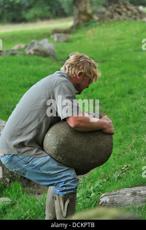Strong man lifting heavy stone Lebanon Middle East Stock Photo - Alamy