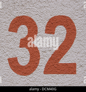 Number thirty-two on the wall of a house, number of information, even ...