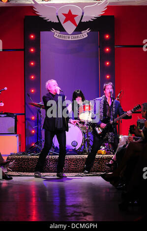 Jimmy Kunes, drummer Marky Ramone and Andy Hilfiger performs after his ...